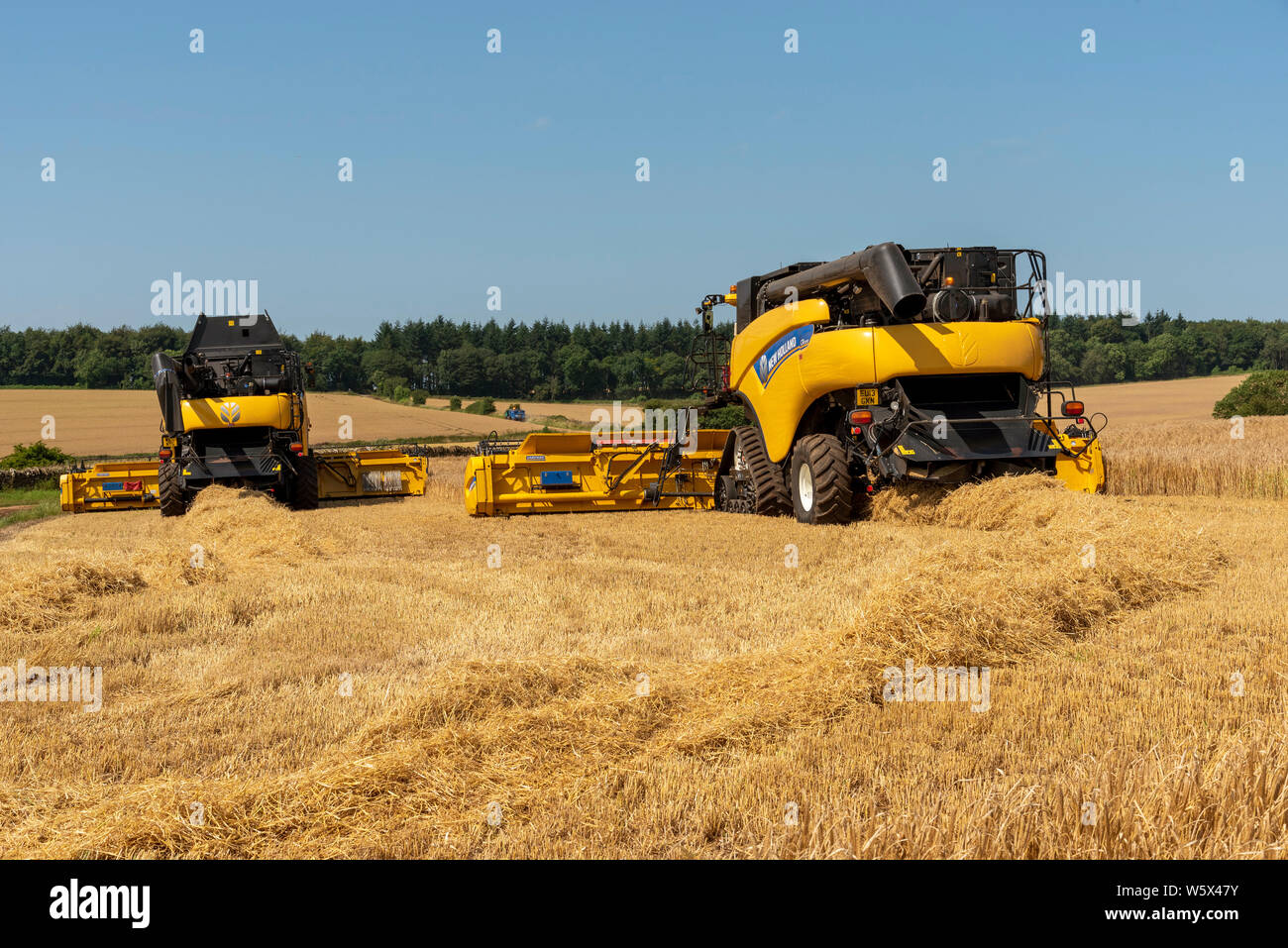 Cheltenham, Gloucestershire, England, UK. Two combine harvesters ...