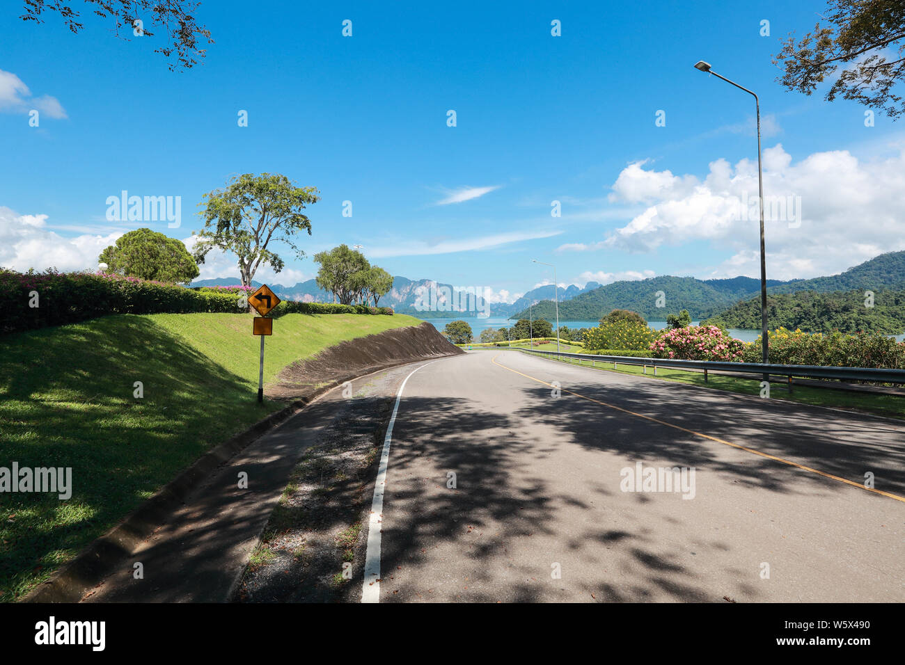 traffic sign on beautiful mountain road with blue sky Stock Photo - Alamy