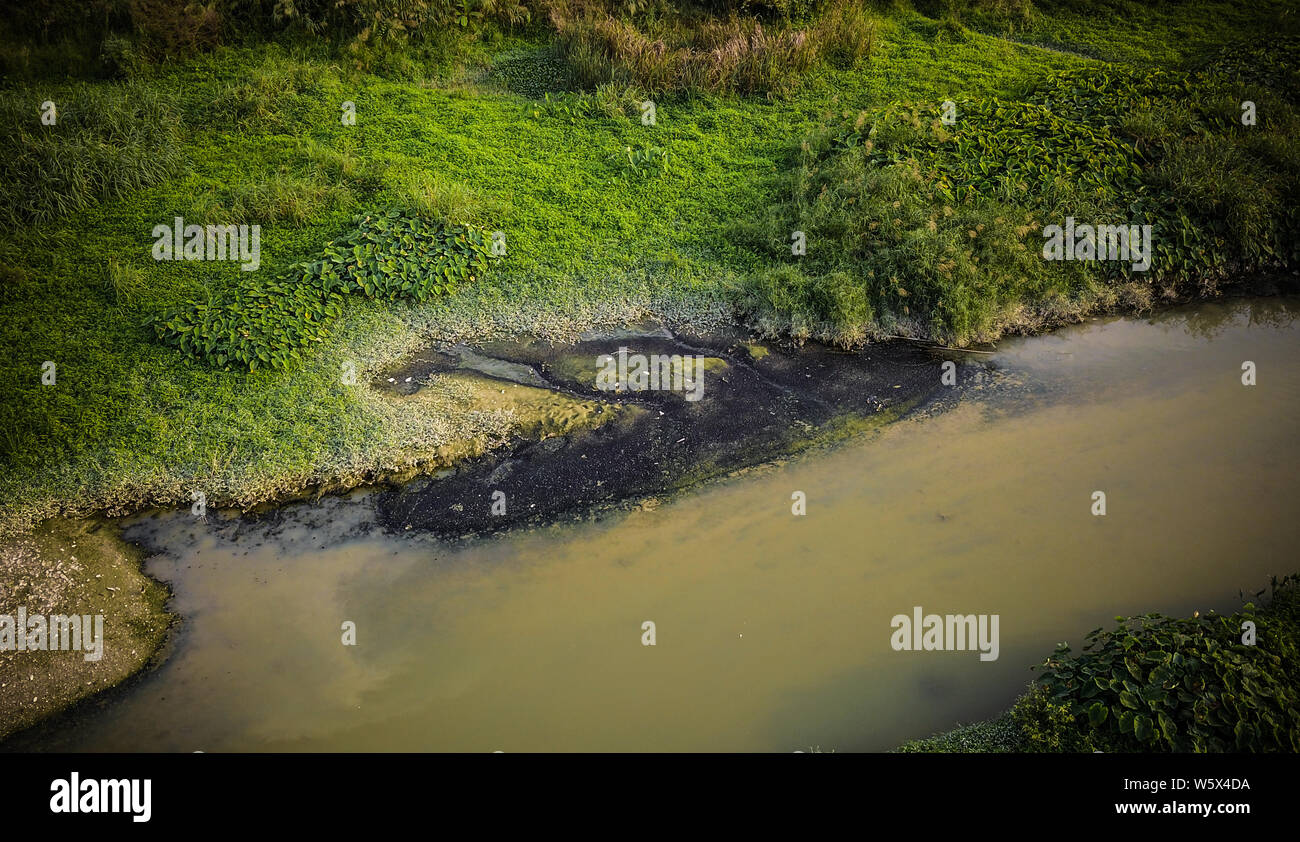 Aerial view of the Zhupaichong river polluted by dirty water flowed out ...