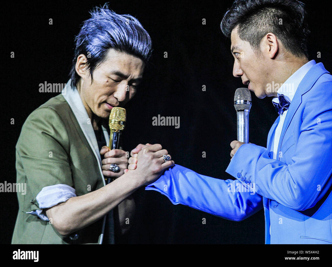 --FILE--Singers Chen Yufan, left, and Hu Haiquan of Chinese pop duo Yu ...
