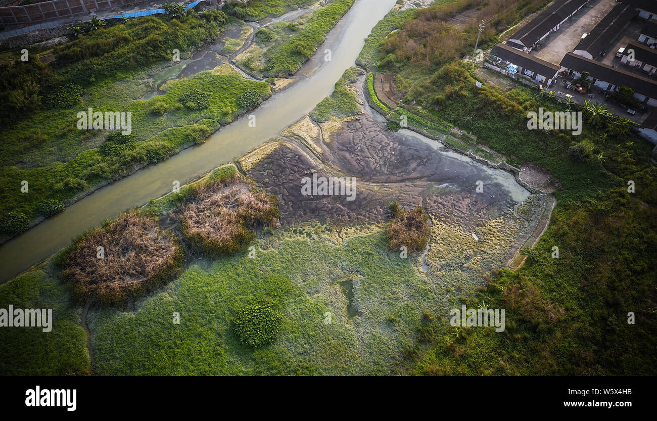 Aerial view of the Zhupaichong river polluted by dirty water flowed out ...