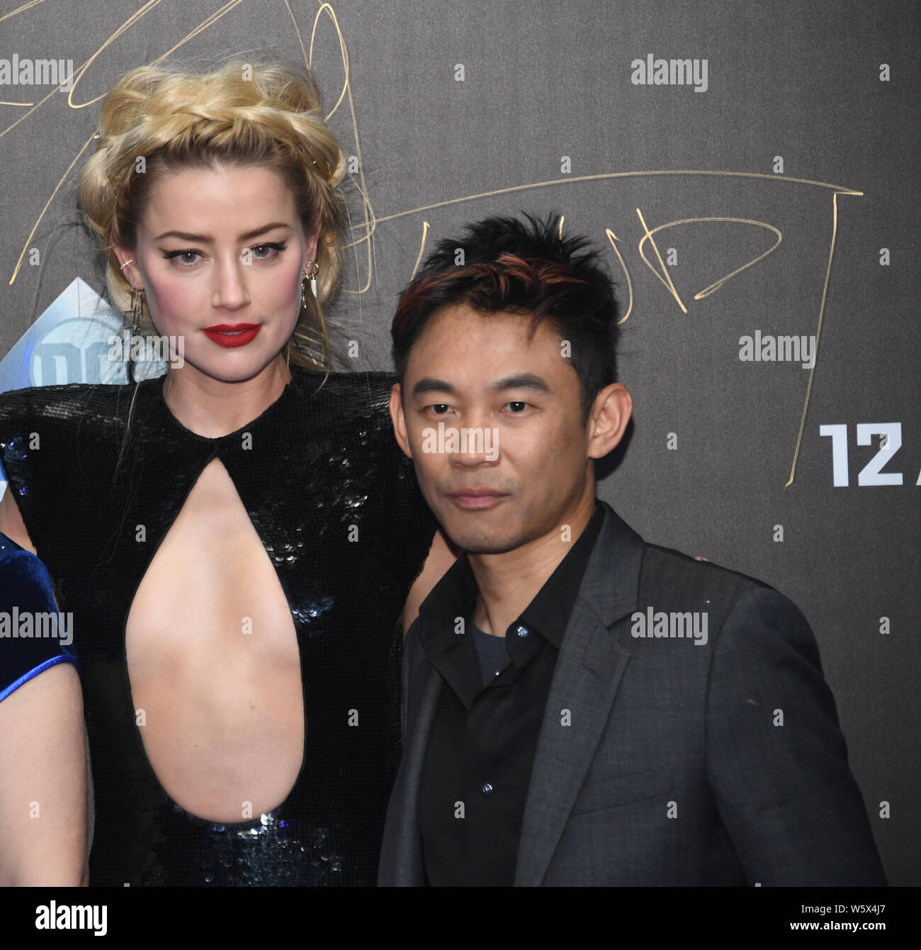 American actress Amber Heard, left, arrives on the red carpet for the ...