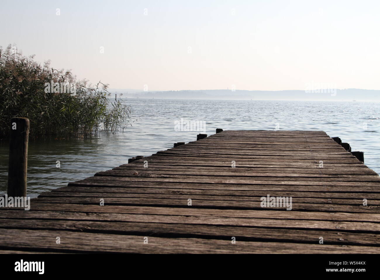 wooden pier on the water Stock Photo - Alamy