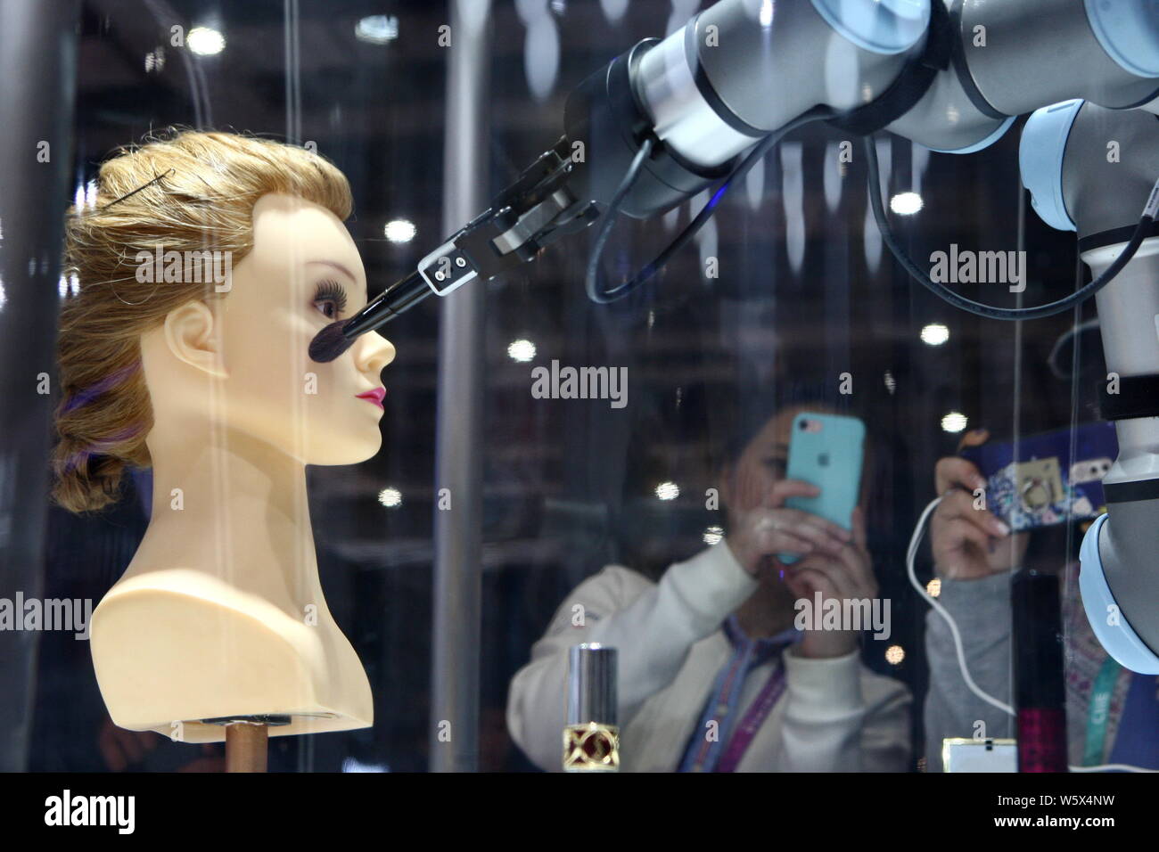 A make-up robot of L'Oreal Paris is on display during the First China ...