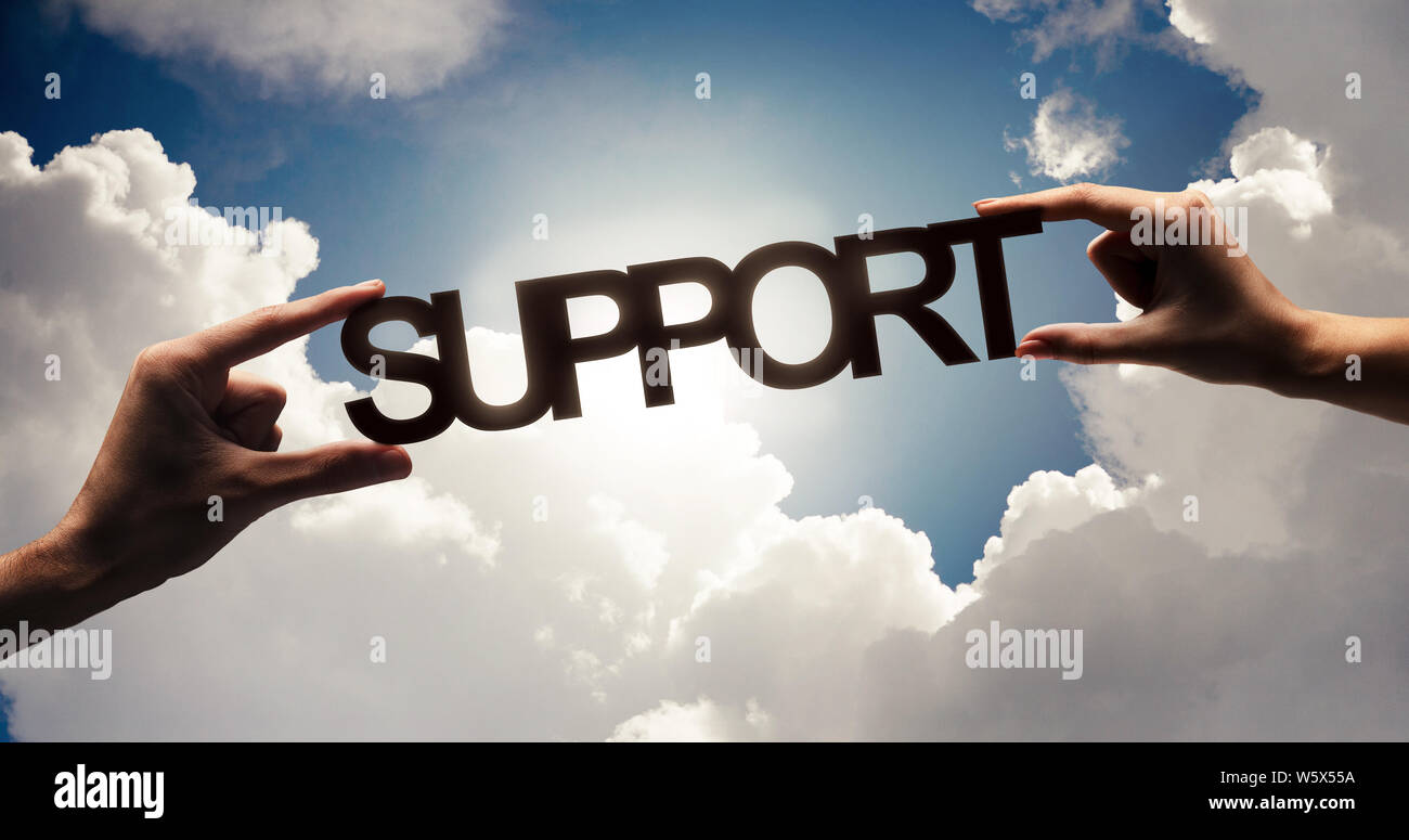 Big text support in woman hands in front of blue sky with clouds Stock ...