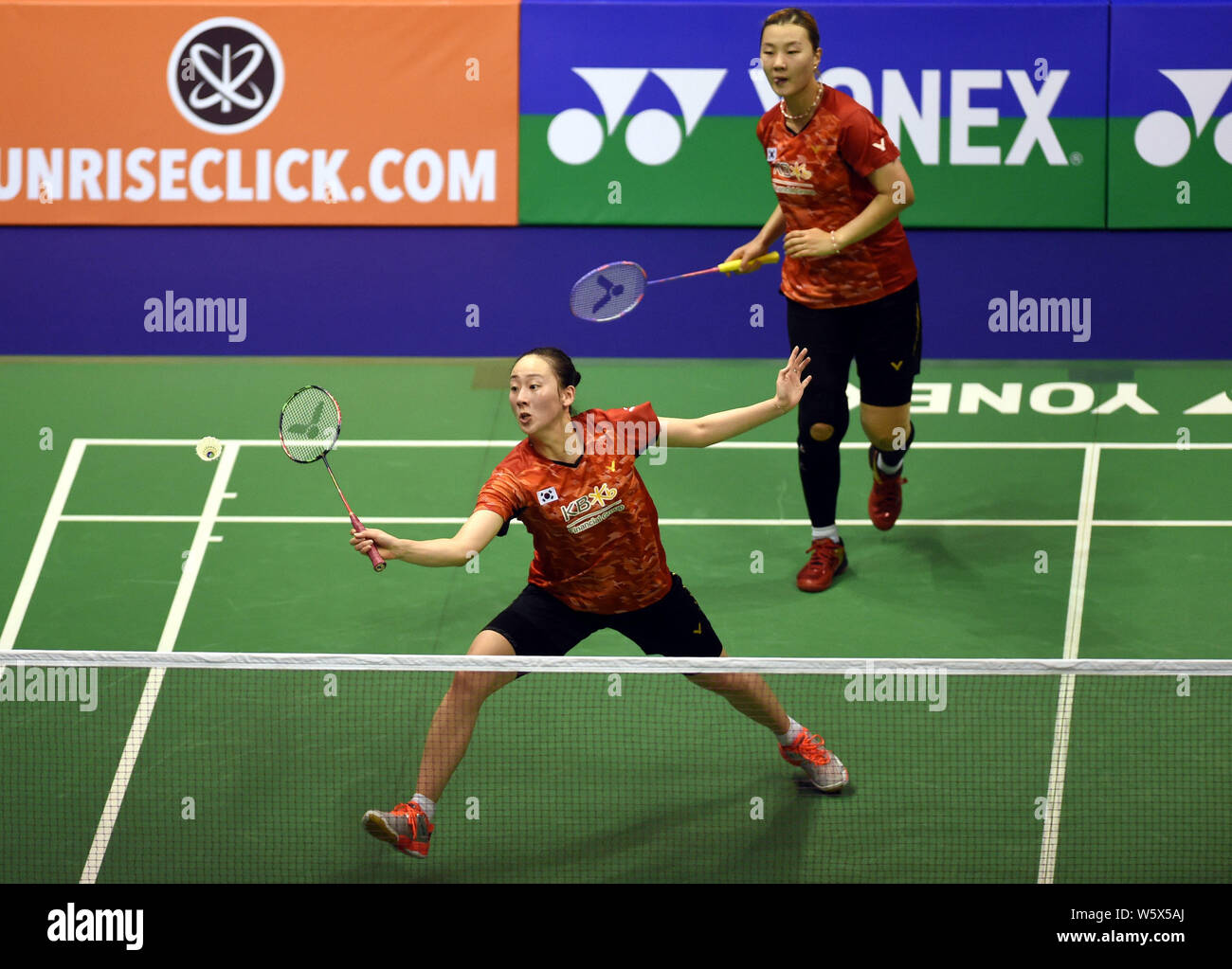 Lee So-hee and Shin Seung-chan of South Korea return a shot to Yuki ...