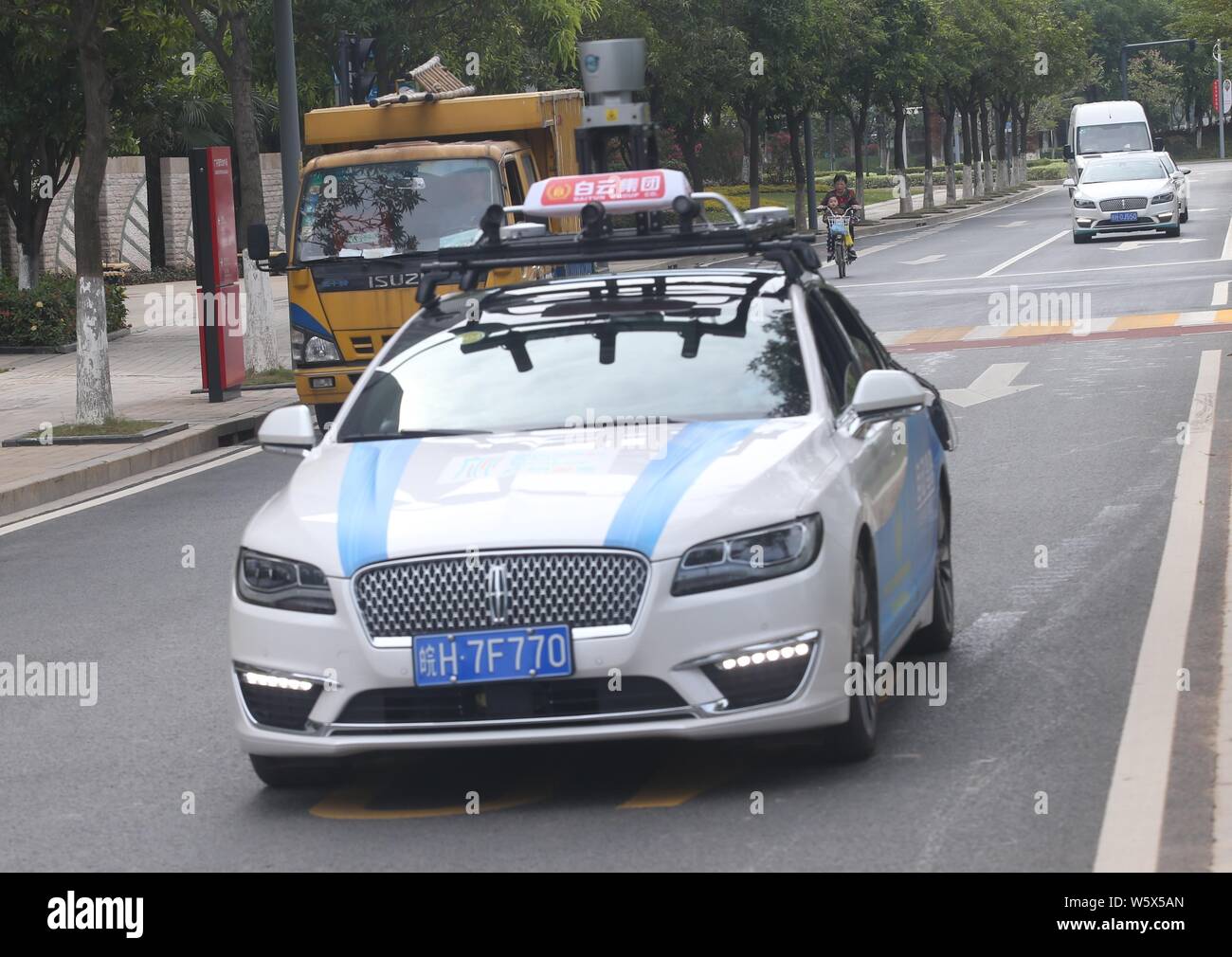 China's first self-driving taxi developed by Guangzhou major public ...