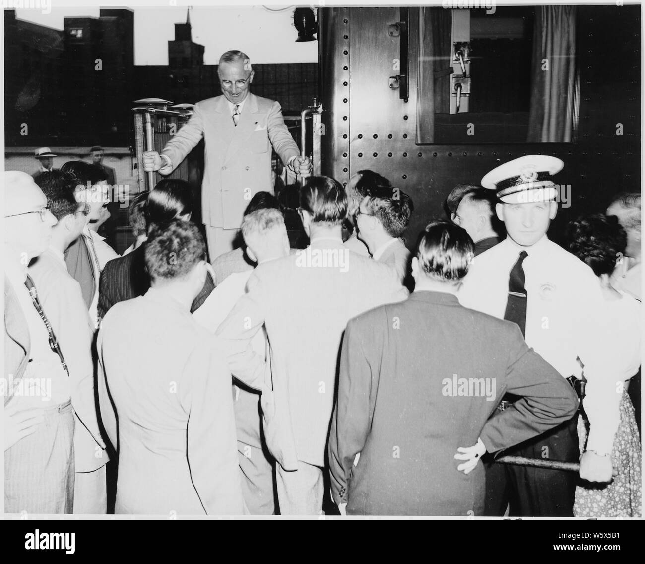 President Harry S. Truman, descending from the rear platform of the ...