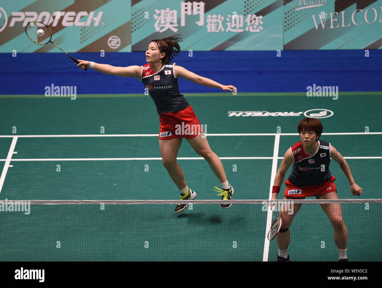 Misato Aratama and Akane Watanabe of Japan compete against Vivian Hoo ...