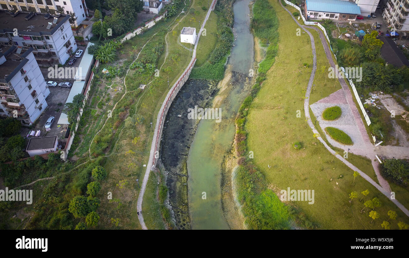 Aerial view of the Zhupaichong river polluted by dirty water flowed out ...