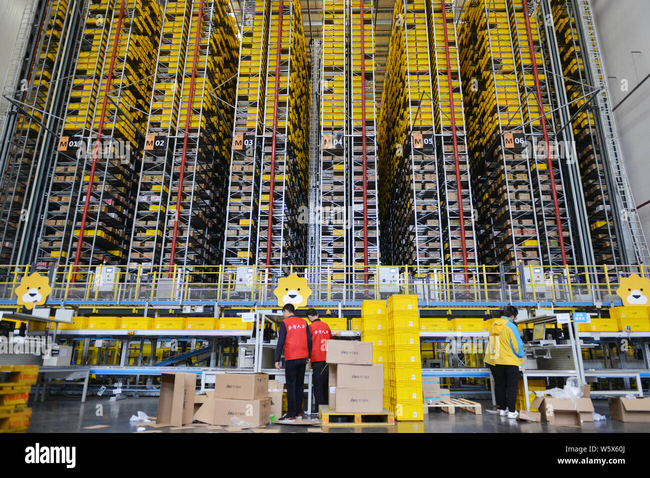 Chinese workers labor at the largest smart logistics base in Asia ...