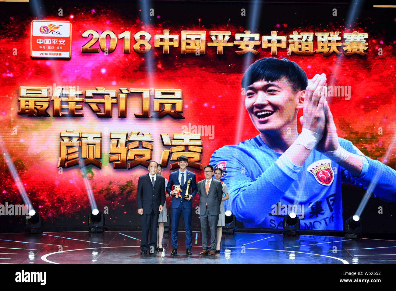 Chinese football player Yan Junling, center, of Shanghai SIPG poses ...