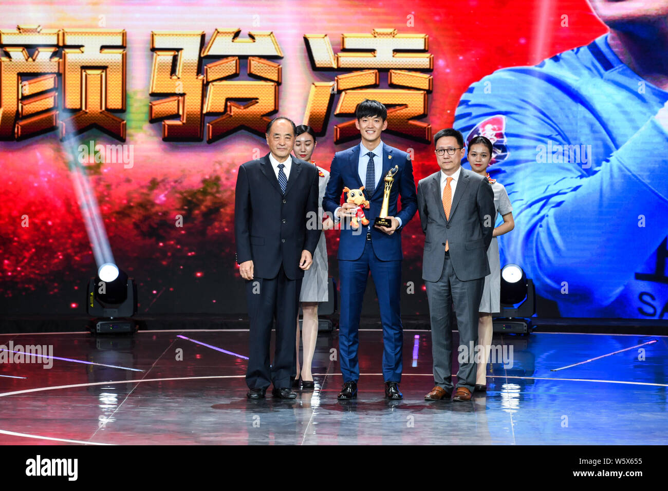 Chinese football player Yan Junling, center, of Shanghai SIPG poses ...