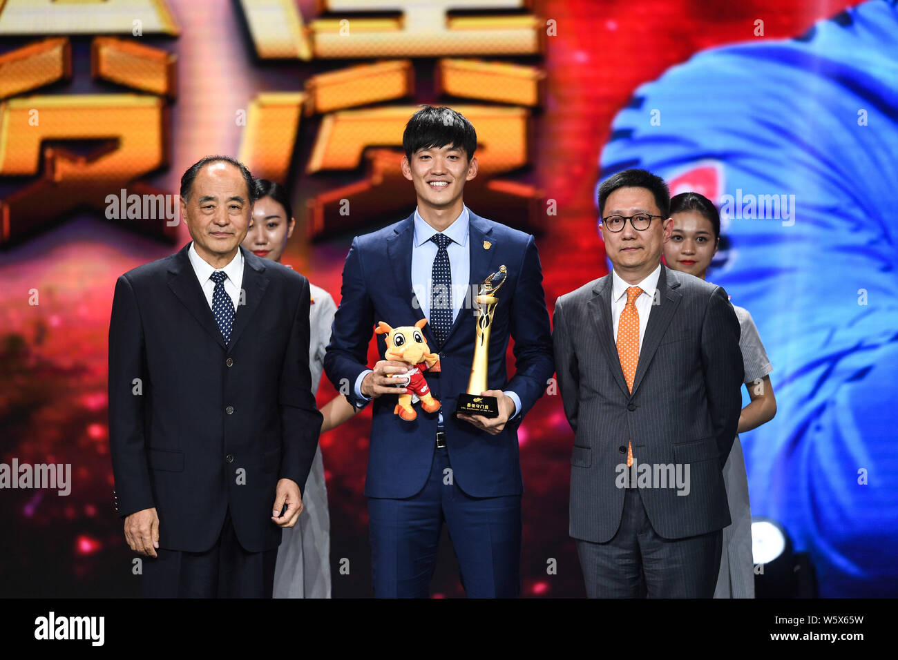 Chinese football player Yan Junling, center, of Shanghai SIPG poses ...