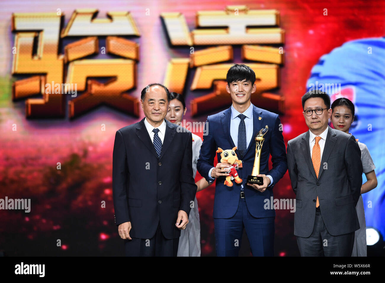 Chinese football player Yan Junling, center, of Shanghai SIPG poses ...