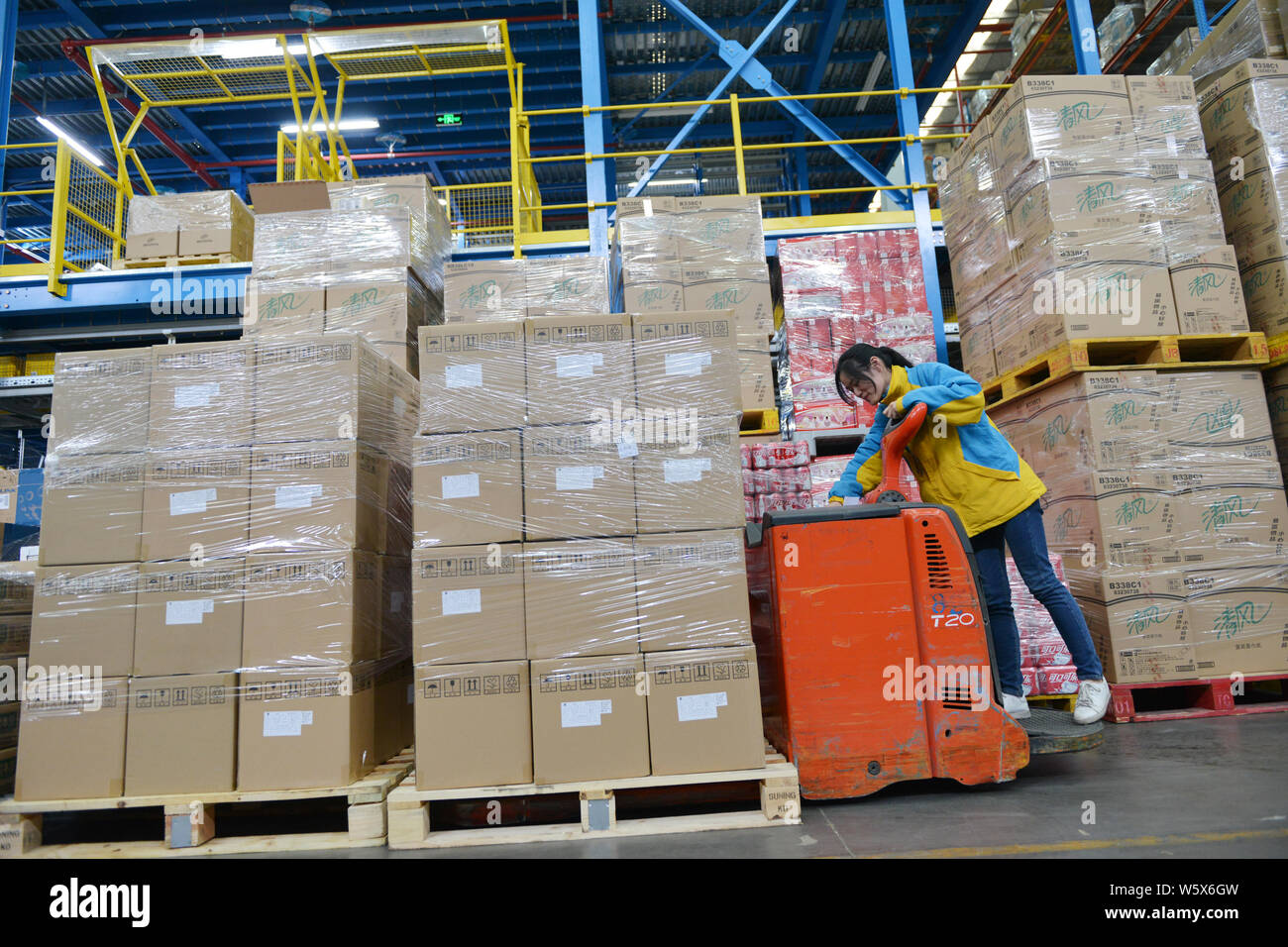 Chinese workers labor at the largest smart logistics base in Asia ...