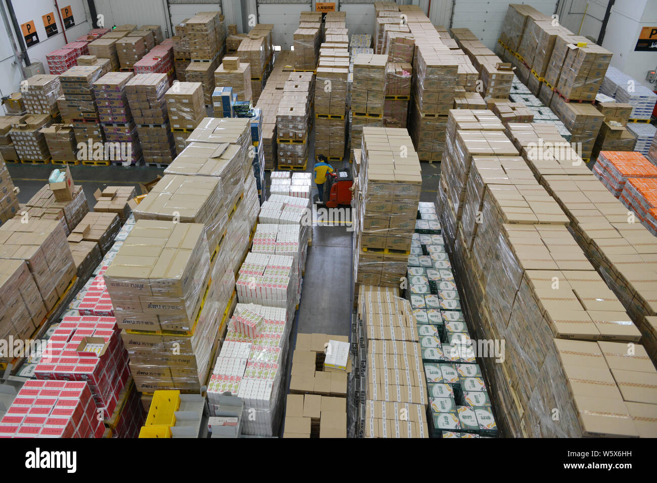 Chinese workers labor at the largest smart logistics base in Asia ...