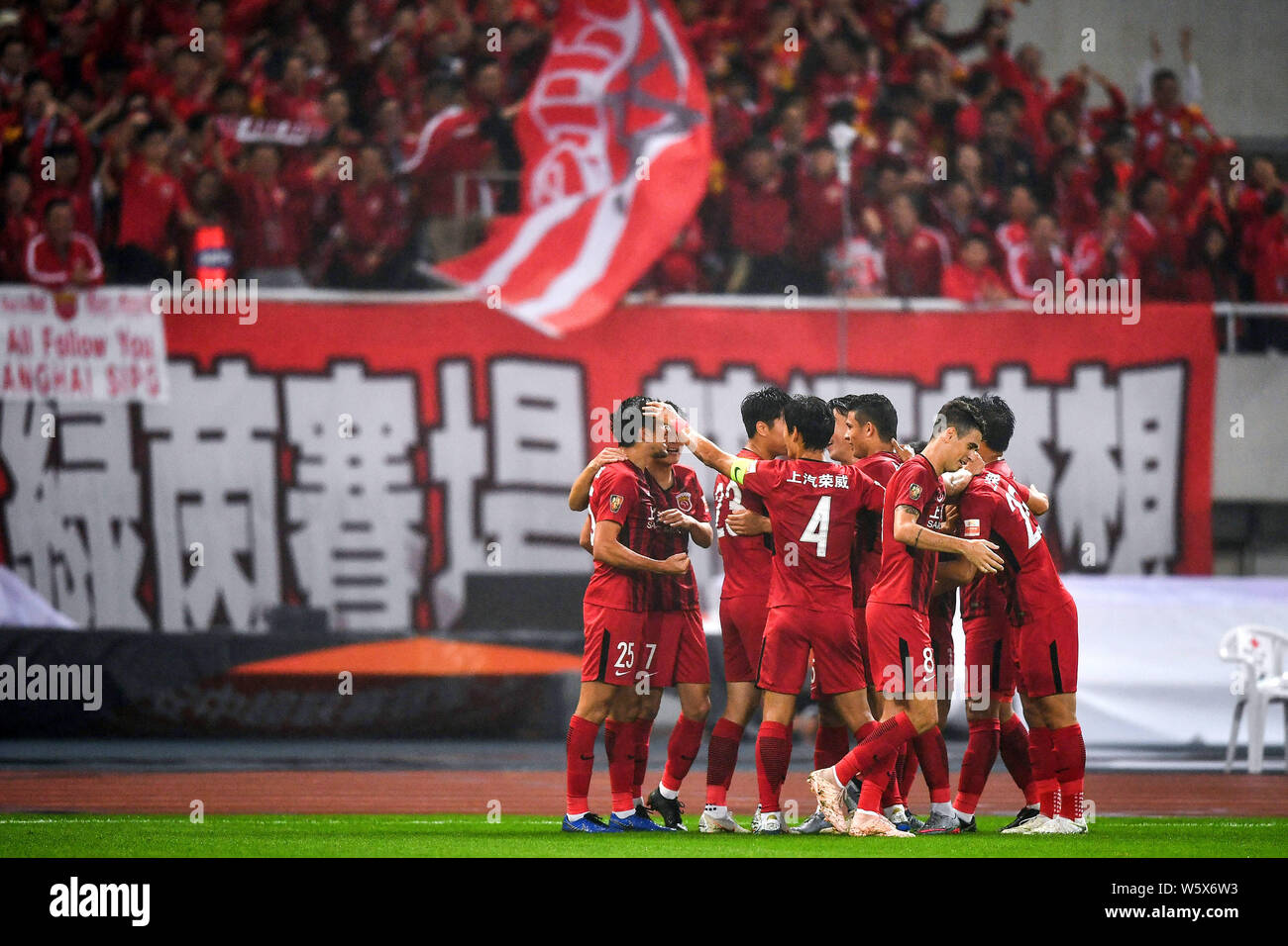 Players of Shanghai SIPG celebrate after defeating Beijing Renhe in the ...