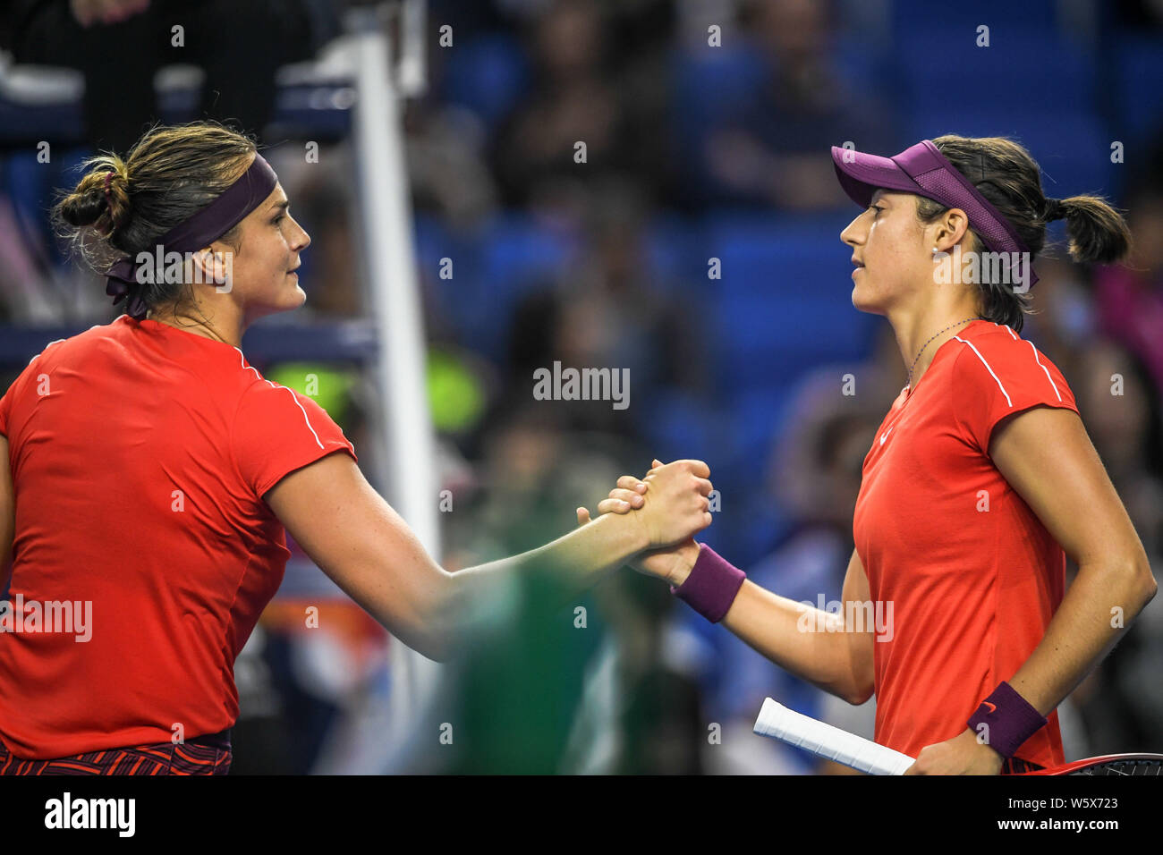 Caroline Garcia of France returns a shot to Aryna Sabalenka of Belarus ...