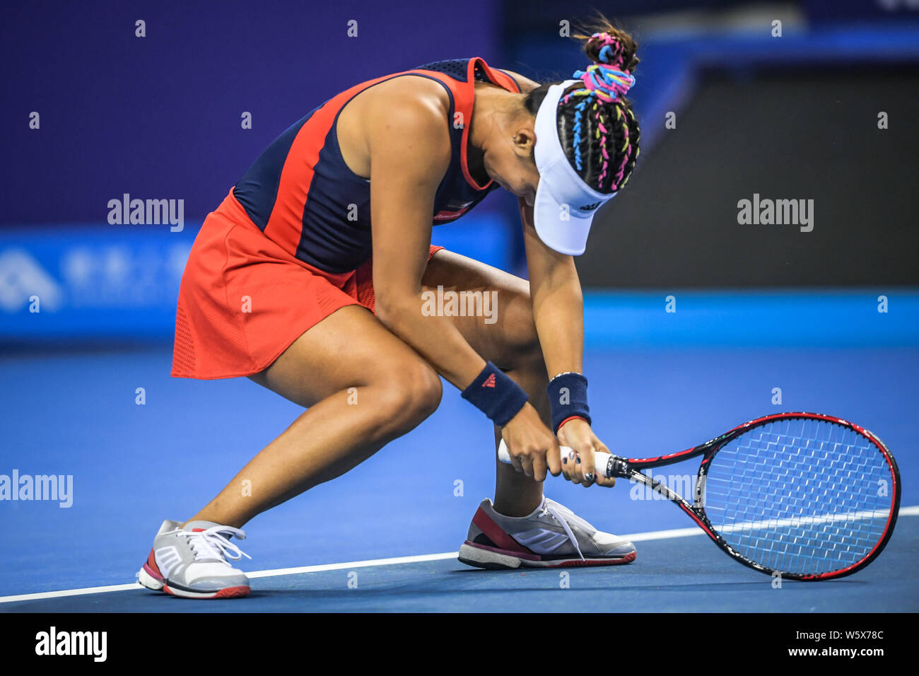 Wang Qiang of China reacts as she competes against Madison Keys of the ...