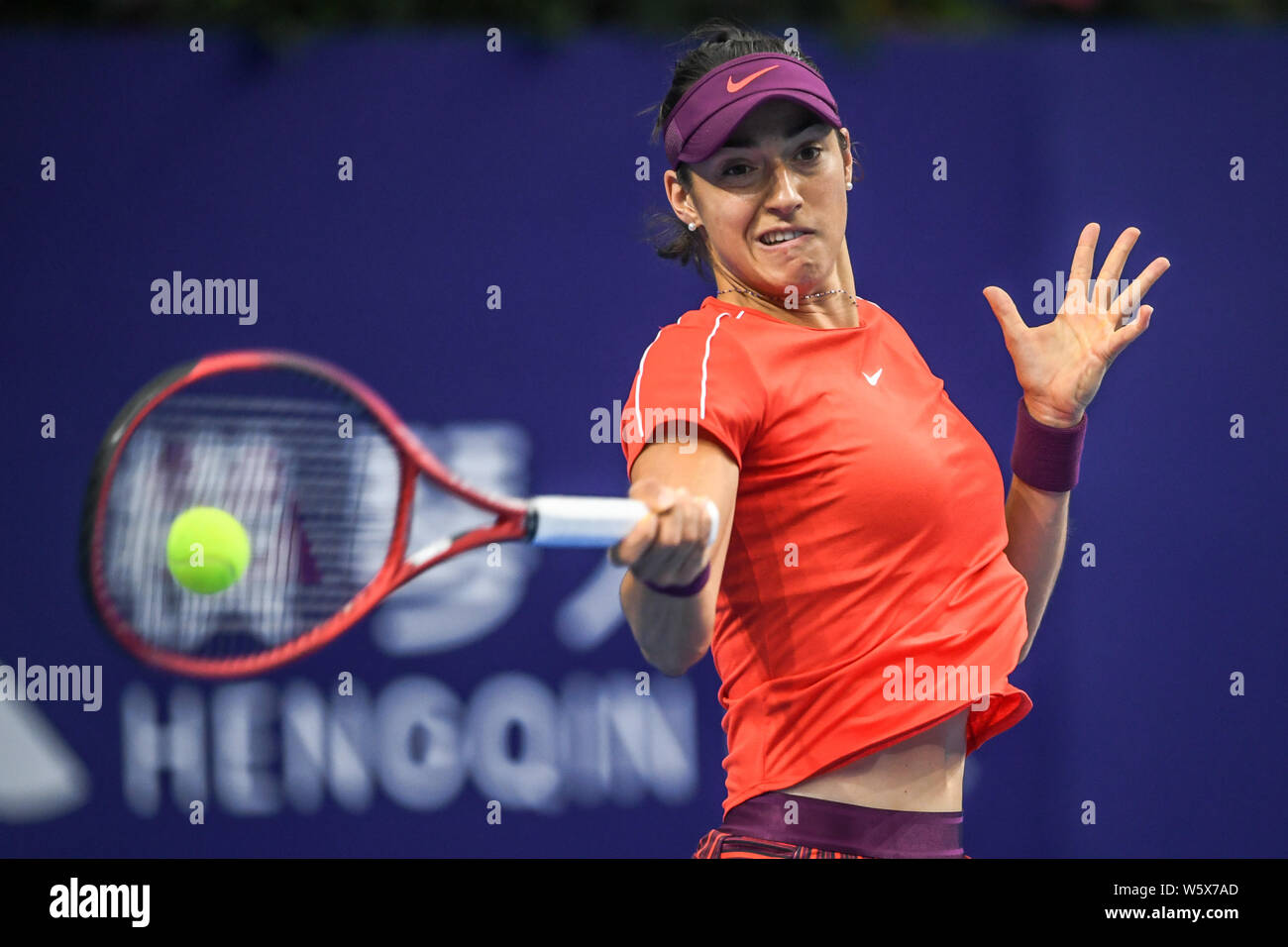Caroline Garcia of France returns a shot to Aryna Sabalenka of Belarus ...