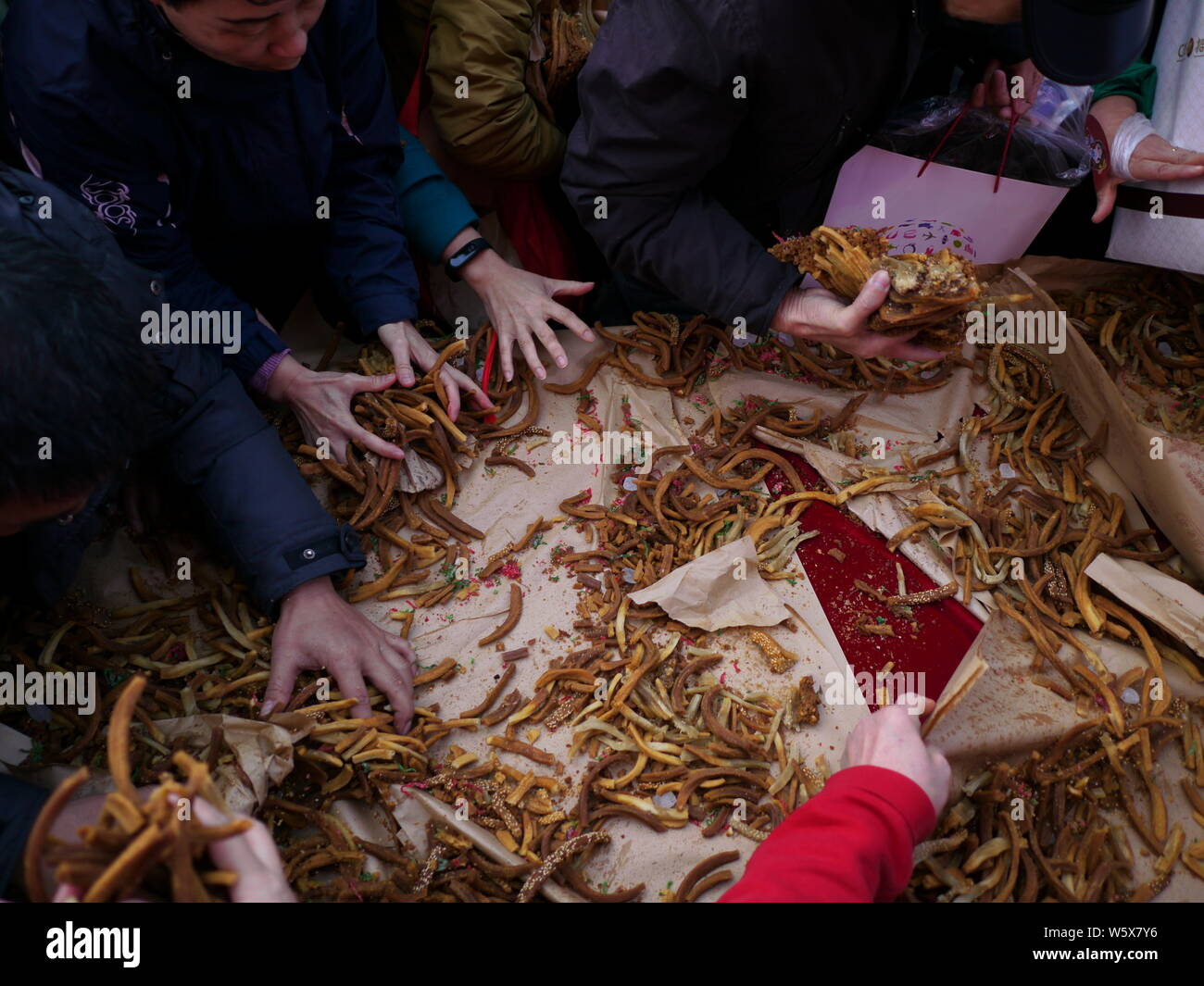 A giant traditional fried dough twisty snack Mahua weighing 59kg is on ...