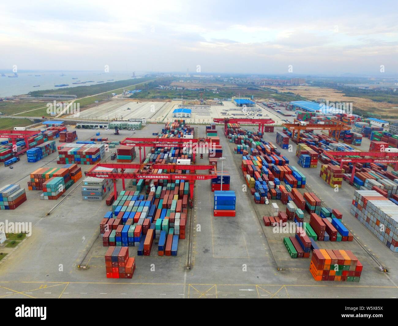 An aerial view of containers stacked at the fully automated container terminal at the Port of ...