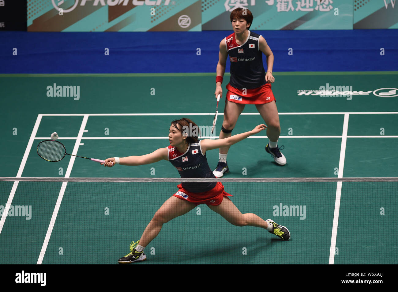 Misato Aratama and Akane Watanabe of Japan compete against Vivian Hoo ...