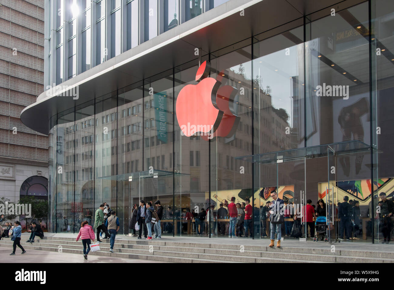 The logo of Apple Inc. is illuminated with red light to mark the World ...