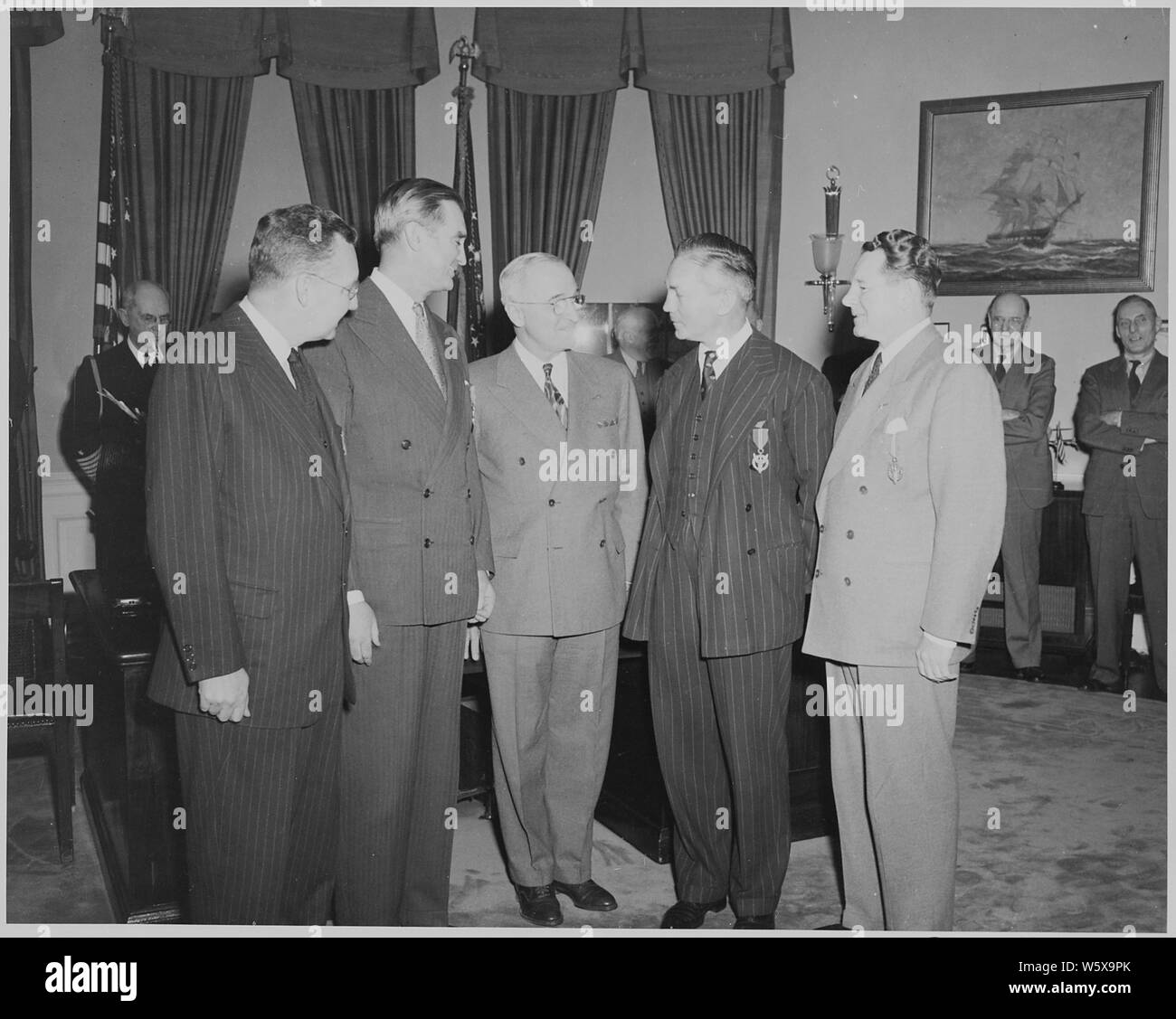 President Truman in the oval office with four men who received the ...