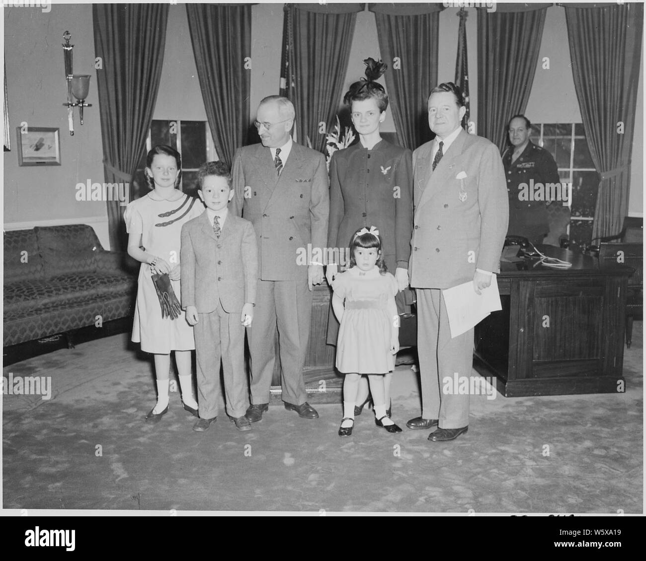 President Truman poses with Secretary of the Navy John L. Sullivan and ...