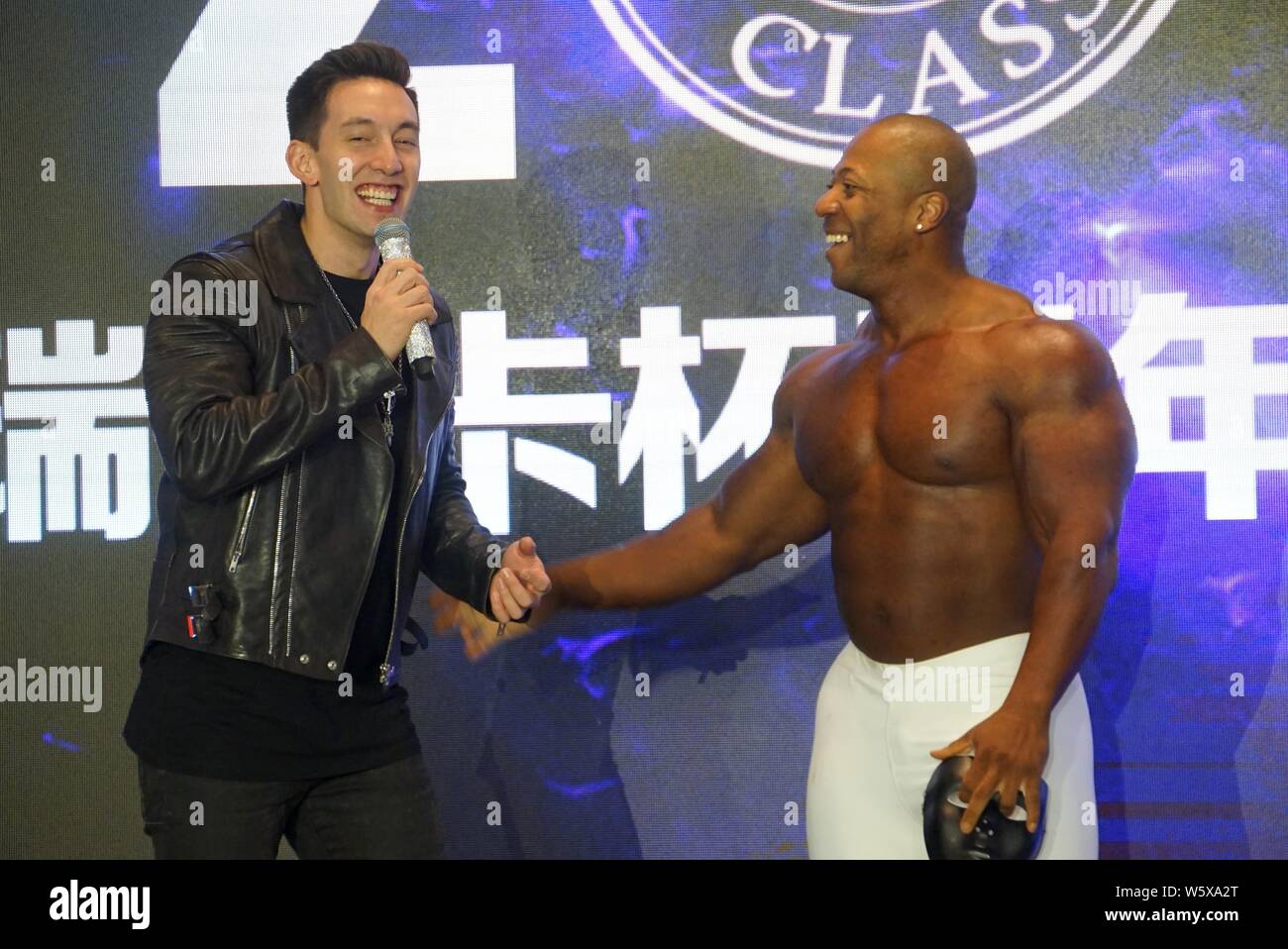Jamaican-American IFBB professional bodybuilder Shawn Rhoden, right ...