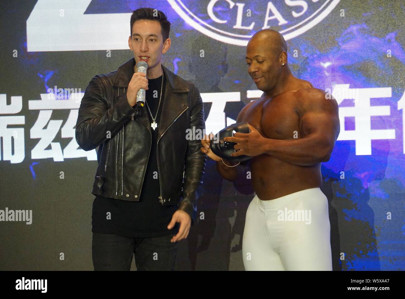 Jamaican-American IFBB professional bodybuilder Shawn Rhoden, right ...