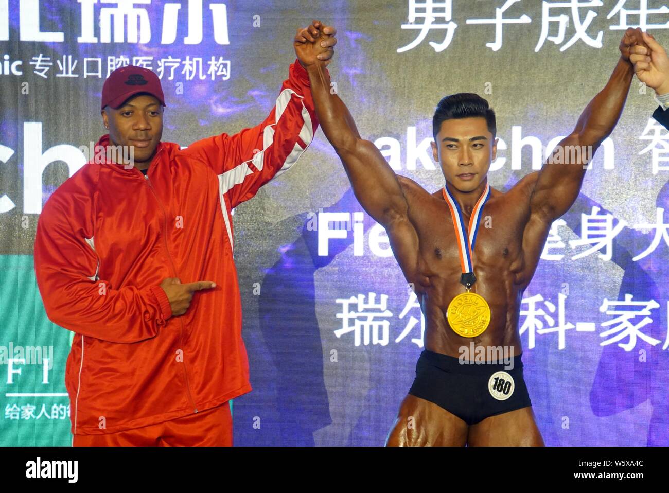 Jamaican-American IFBB professional bodybuilder Shawn Rhoden, left ...