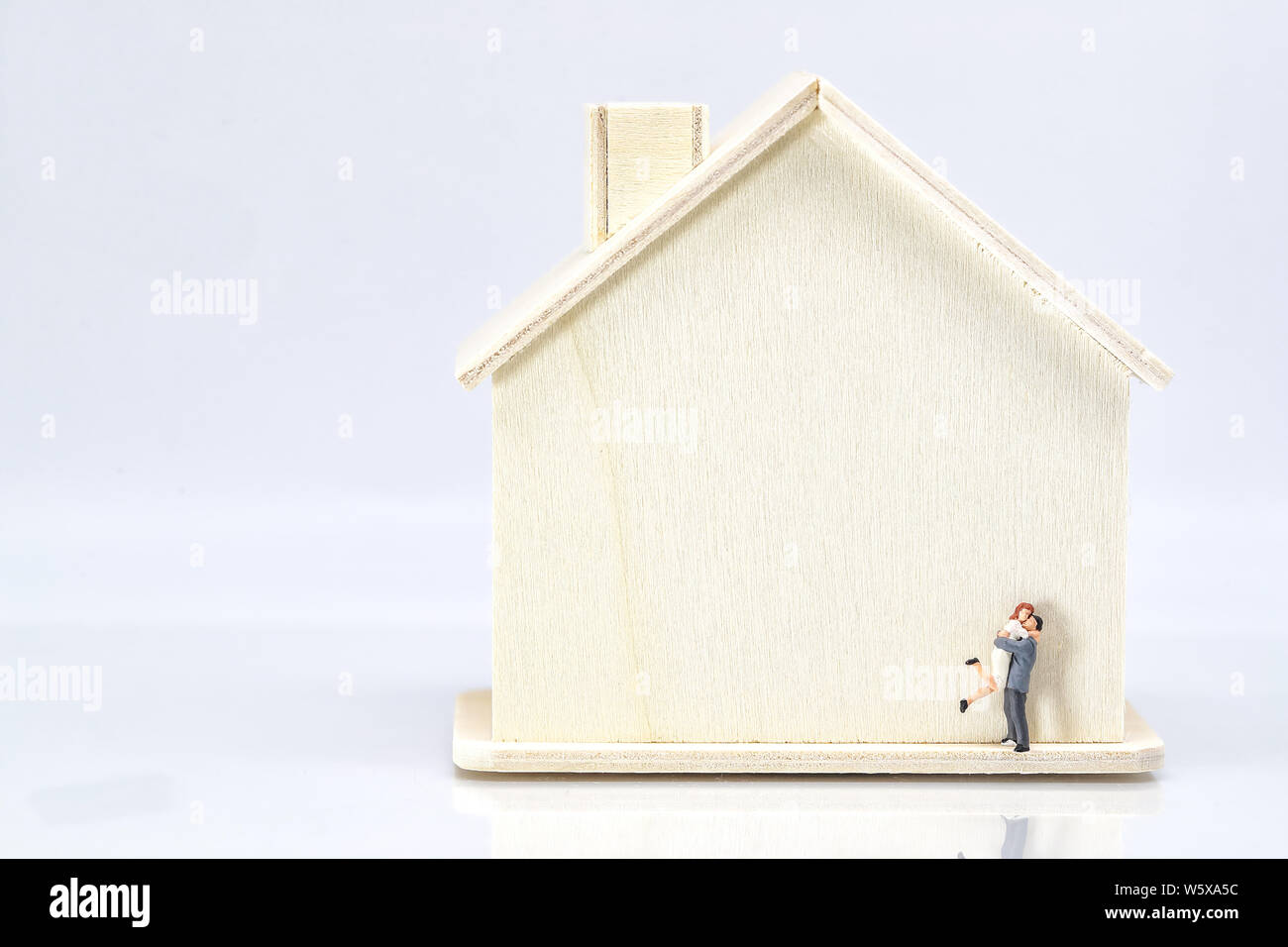 a couple standing beside house Stock Photo - Alamy