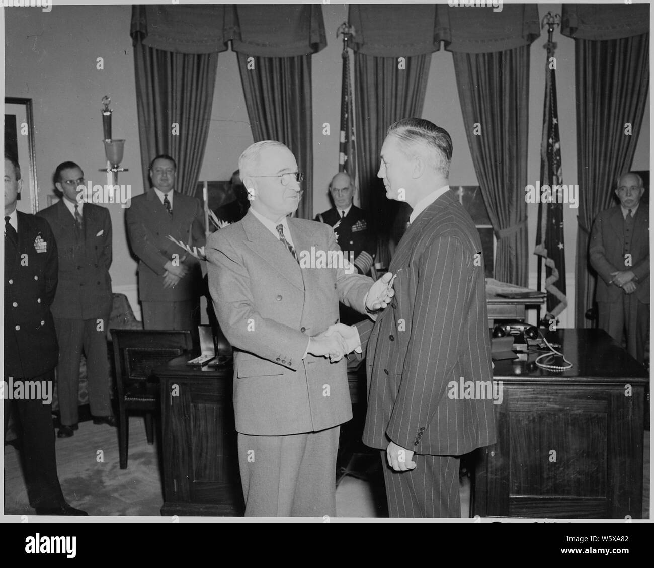 President Truman presents a Medal of Merit to Secretary of Defense ...