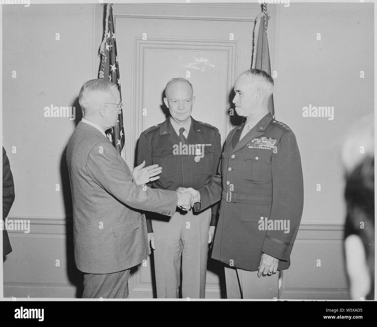 President Truman shakes hands with Gen. Omar Bradley, who has just been ...