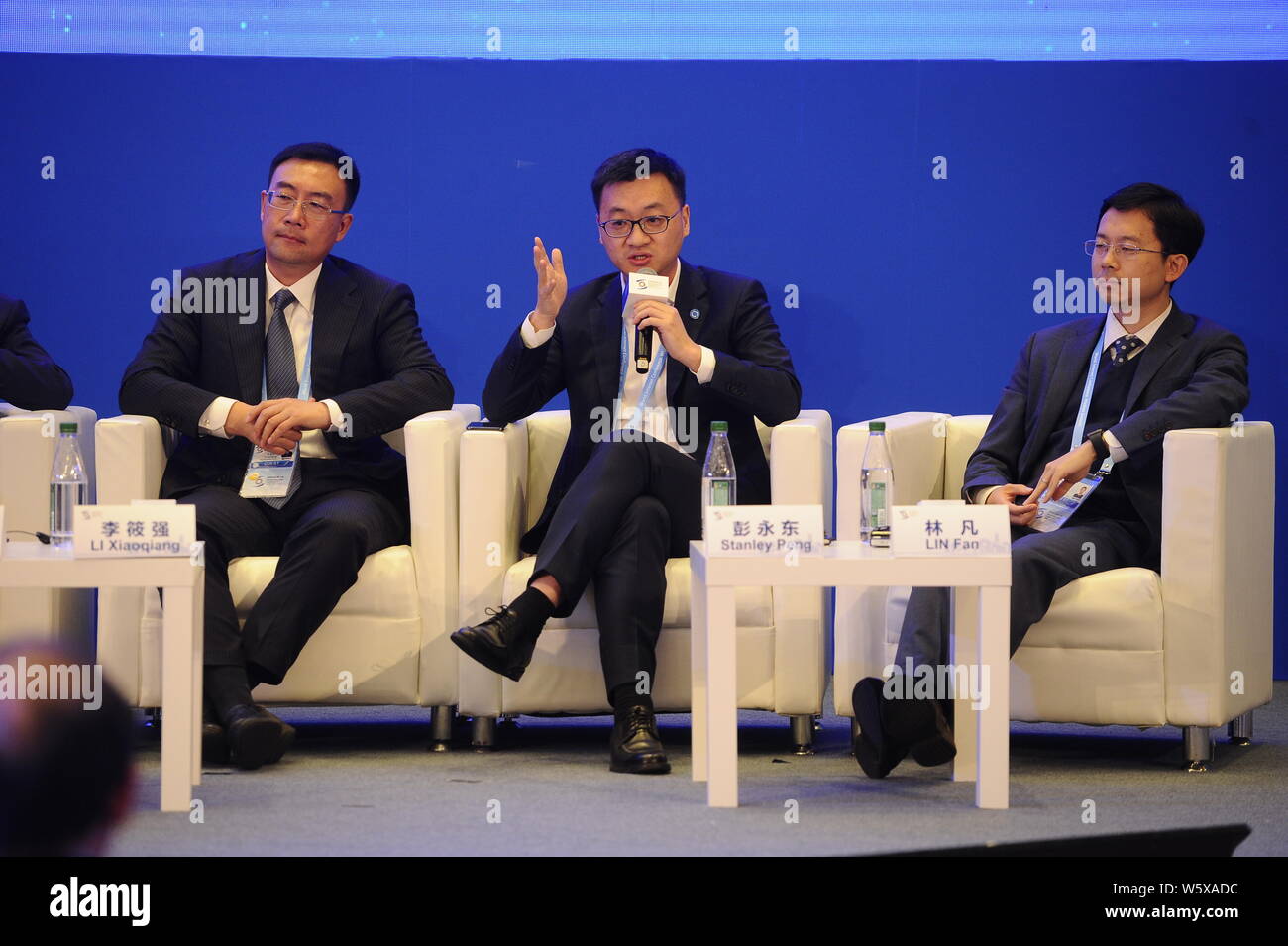 Peng Yongdong, CEO of HOME LINK, center, and Lin Fan, founder & CEO of ...