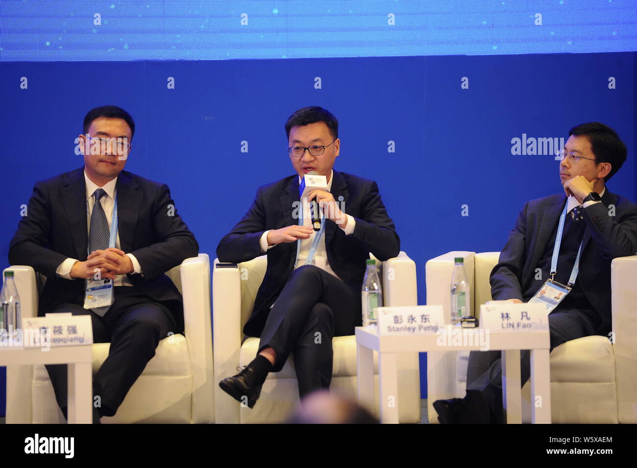 Peng Yongdong, CEO of HOME LINK, center, and Lin Fan, founder & CEO of ...