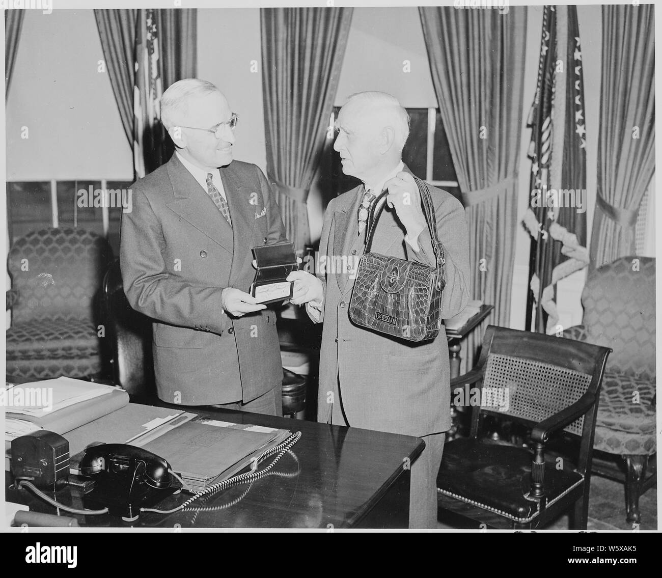 President Truman, in the oval office, receives tickets to a baseball ...