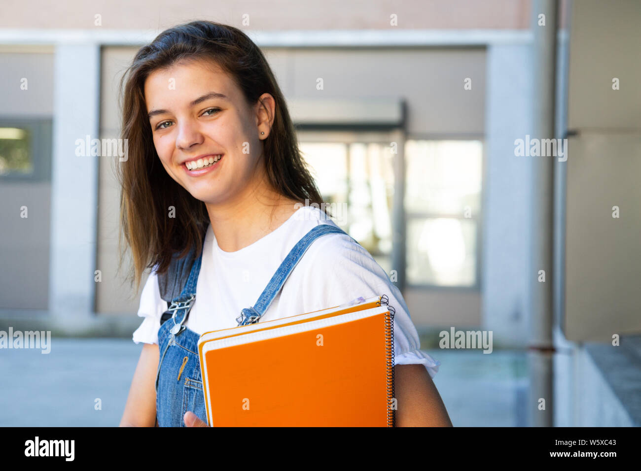 Girl in denim overalls hi-res stock photography and images - Alamy