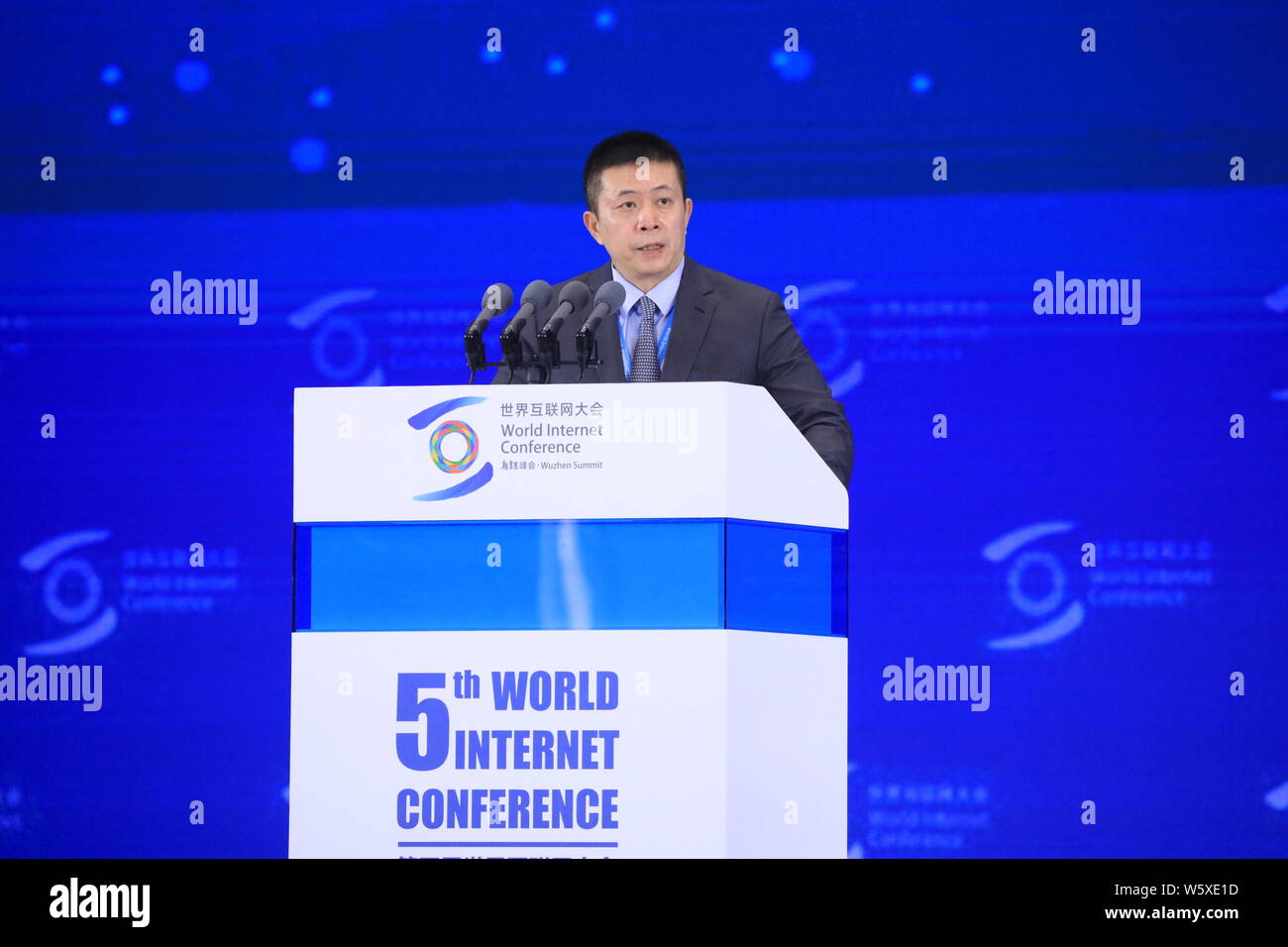 Charles Chao or Cao Guowei, CEO of Sina.com, speaks during the opening ...