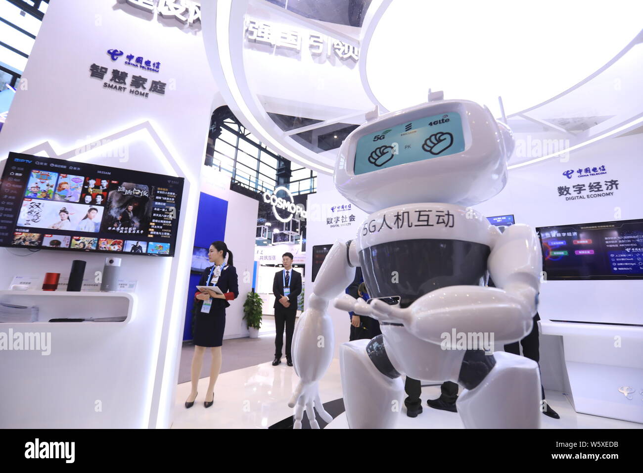 An interactive 5G finger-gaming robot is on display at the stand of ...