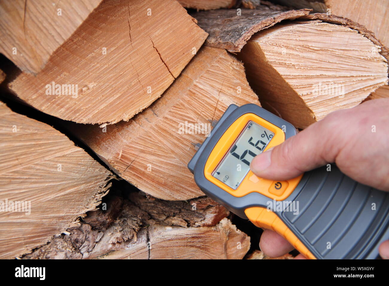 Measure moisture in firewood Stock Photo - Alamy