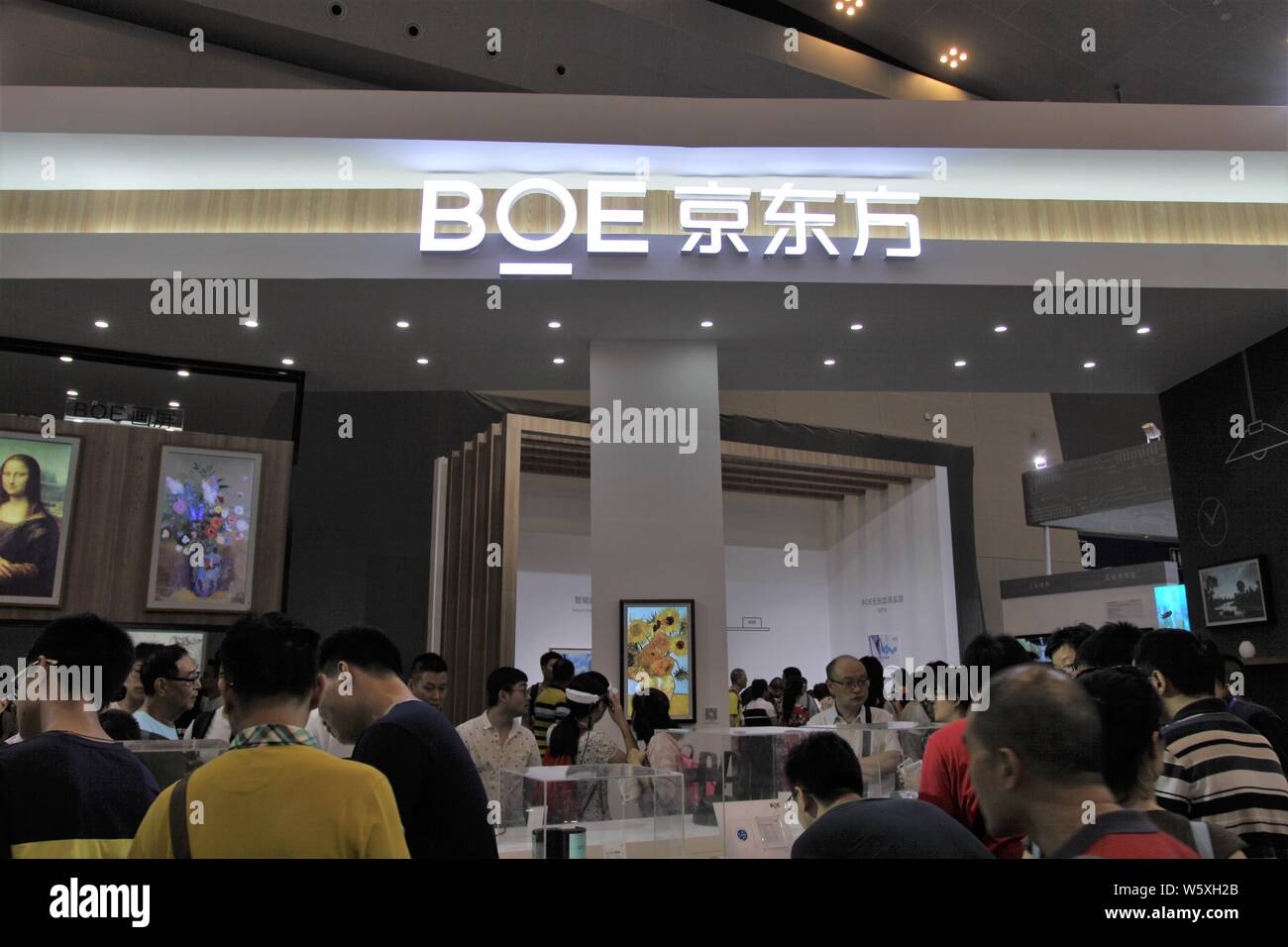 --FILE--People visit the stand of BOE Technology Group during an ...