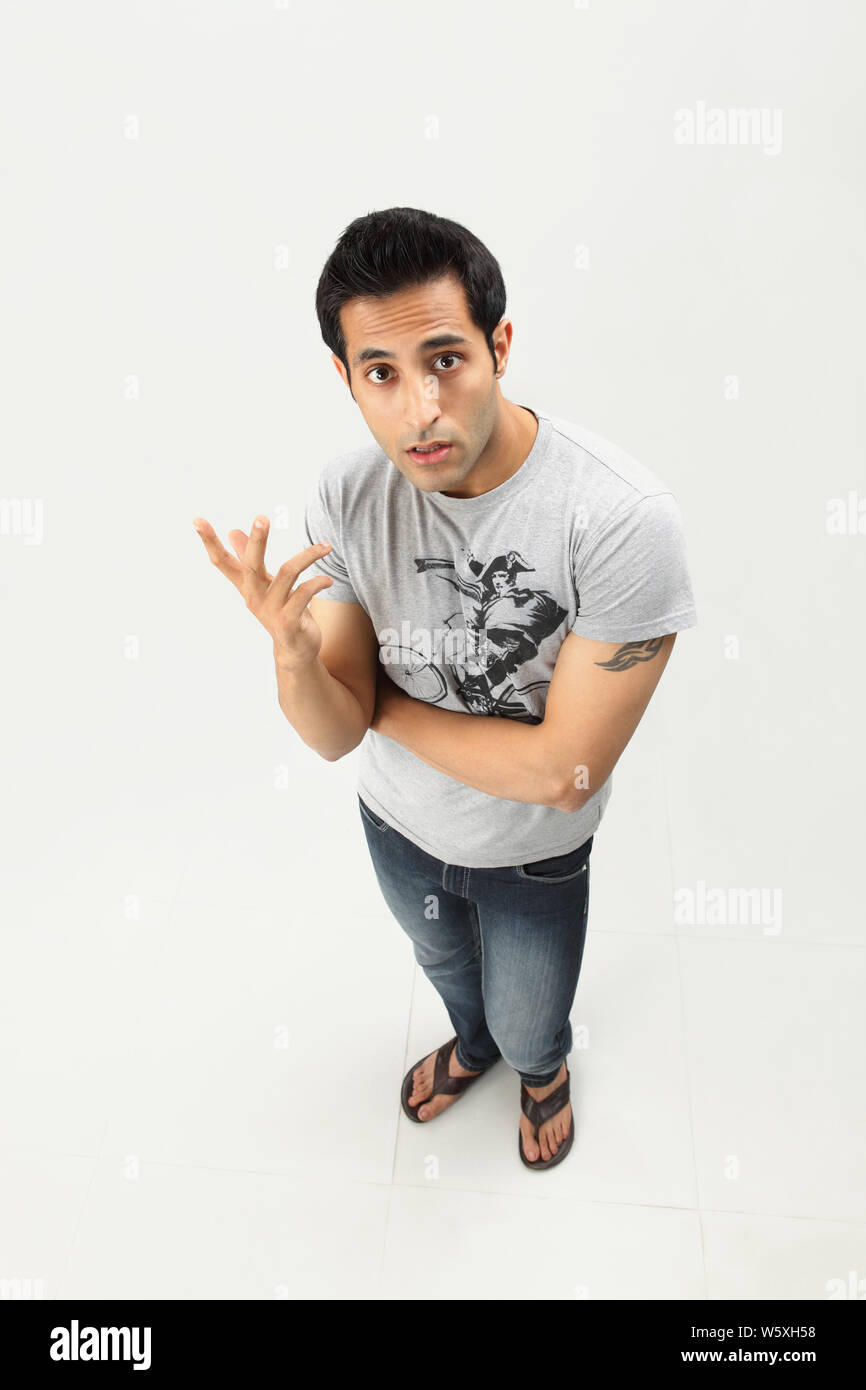 High angle view of an Indian man looking shocked Stock Photo - Alamy