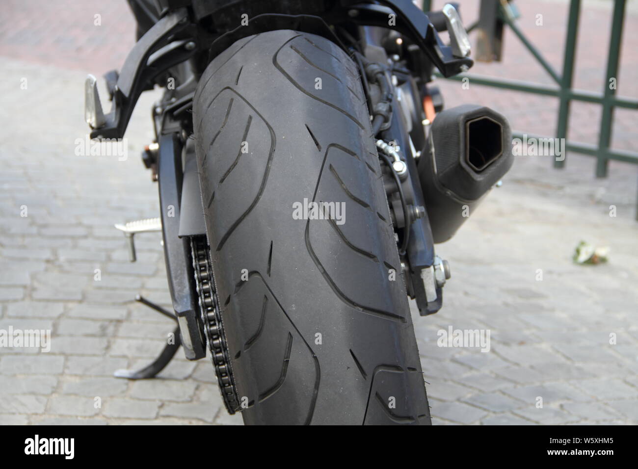 a motorcycle tire from behind with exhaust Stock Photo - Alamy