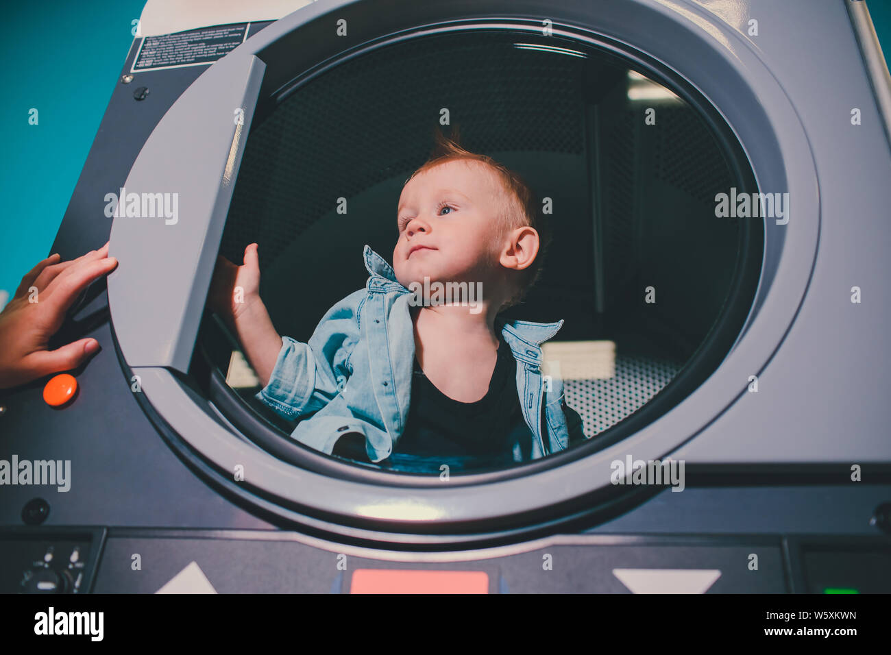 Head in clothes dryer hi-res stock photography and images - Alamy