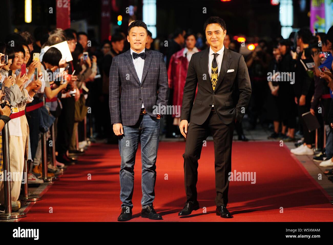 Taiwanese actor and singer Ming Dao, right, arrives on the red carpet ...