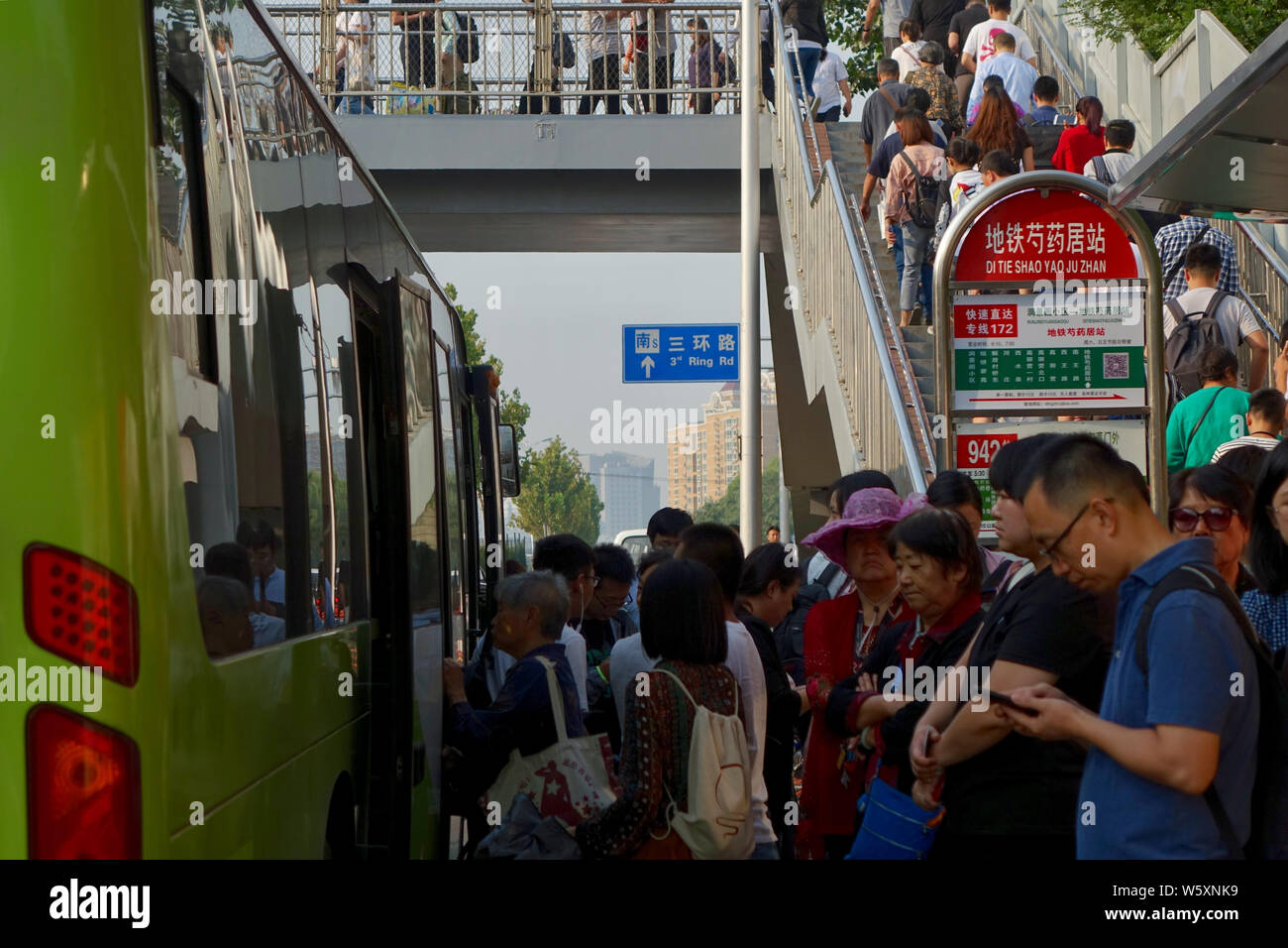 Chinese commuters wait buses hi-res stock photography and images - Alamy